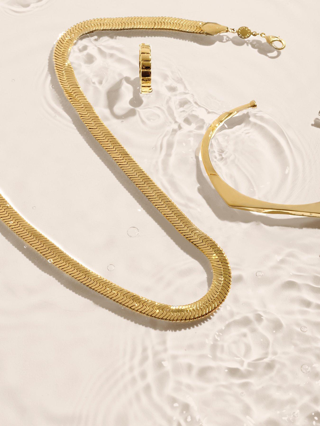 Katie Loxton Signet Waterproof Gold Bangle | Littlewoods